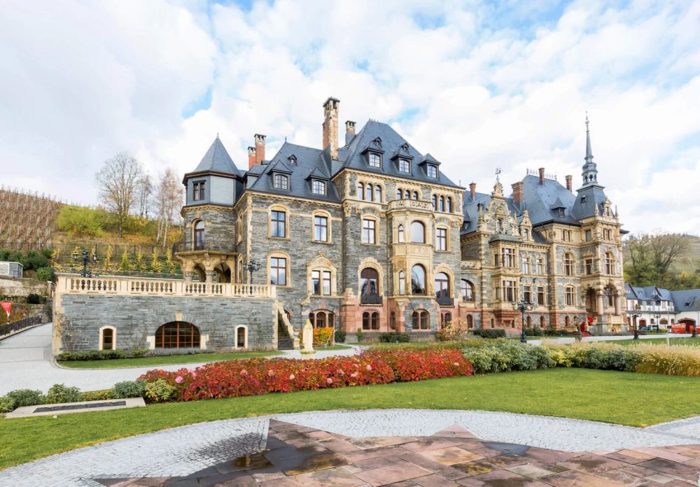 Picturesque castle with vineyards along the river Moselle